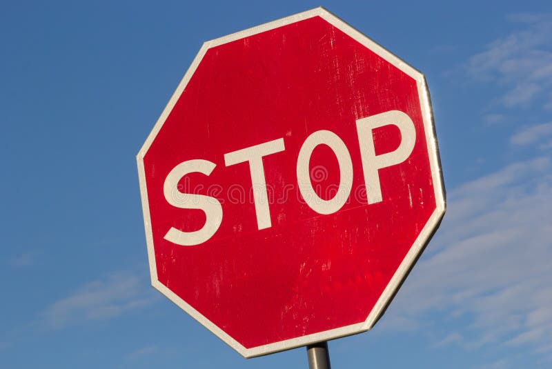 Red Stop Sign with Blue Sky and Clouds Background Stock Photo - Image ...