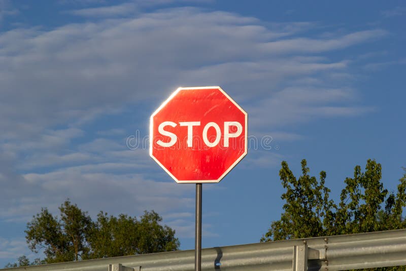 Red Stop Sign with Blue Sky and Clouds Background of the Road Stock ...