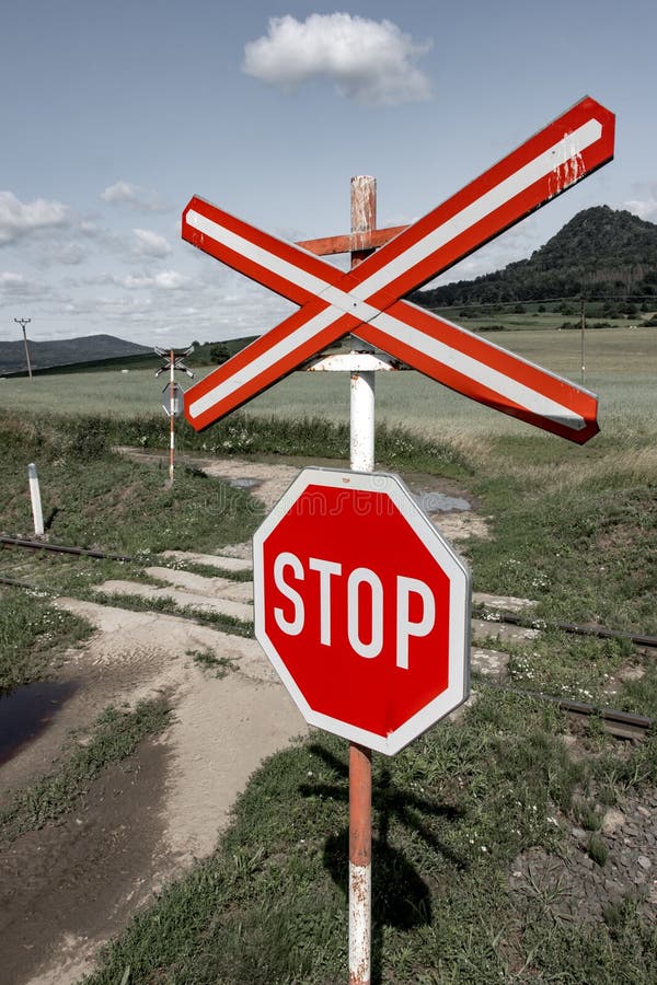 A Red STOP Sign before Crossing the Tracks Stock Image - Image of road ...
