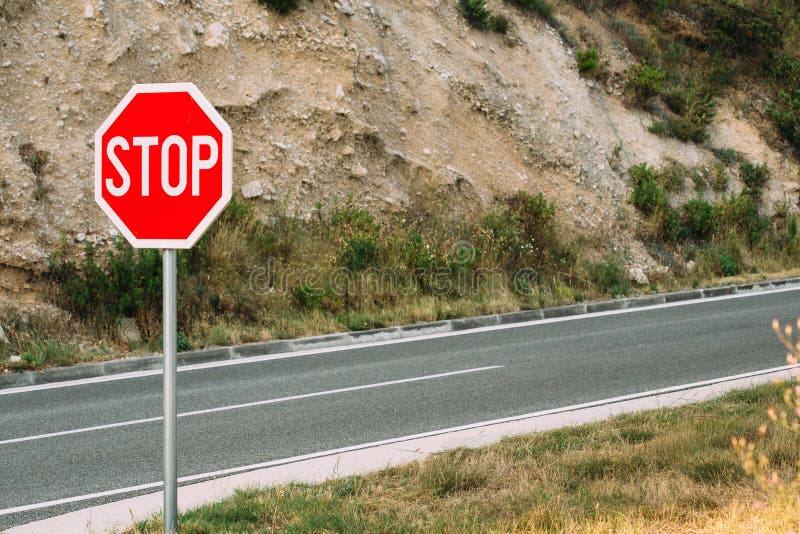 Red Stop Sign Near the Mountain Road Stock Photo - Image of driveway ...