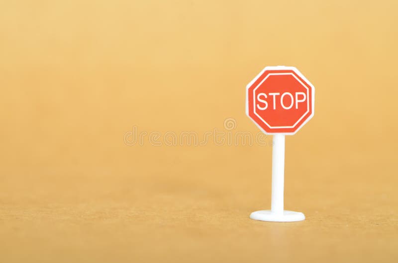 Red STOP Sign on White Pole Emphasizing Halt and Attention in ...