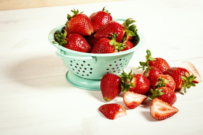 Red Strawberries in Colander on a White Wooden Table Stock Image ...