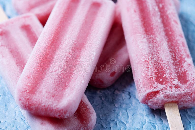Red Strawberry Popsicles on Blue Background Stock Image - Image of ...