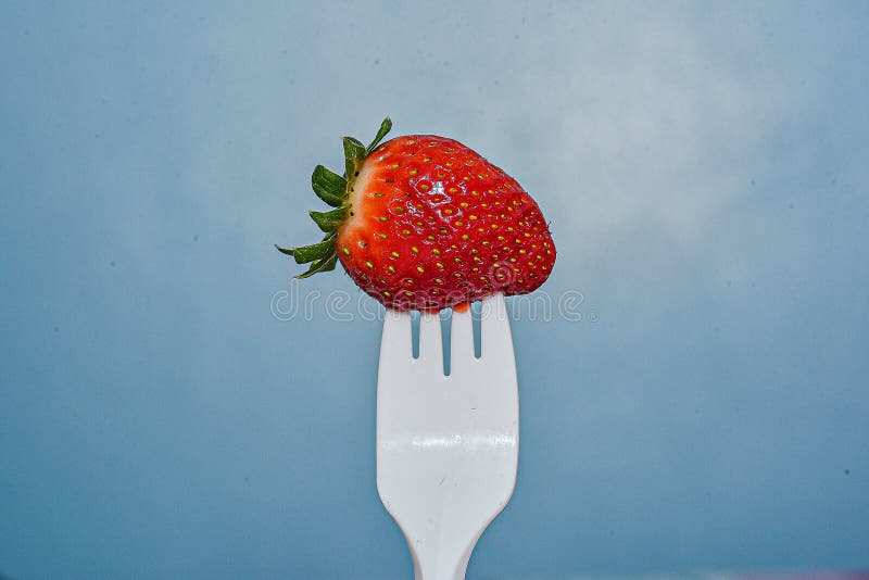 RED STRAWBERRY with a WHITE FORK. Stock Image - Image of strawberry ...