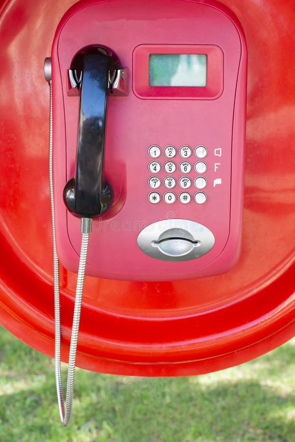 Red Street Phone with Black Handset on the Street Stock Image - Image ...