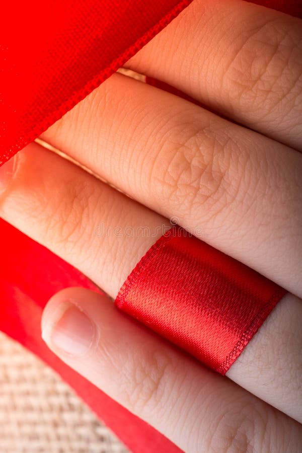Red String Tied Around Ring Finger Stock Photo - Image of forgetfulness ...