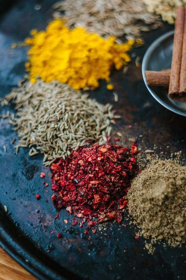 Red Sumac Spice on Black Metal Plate Surrounded by Other Spices. Stock ...