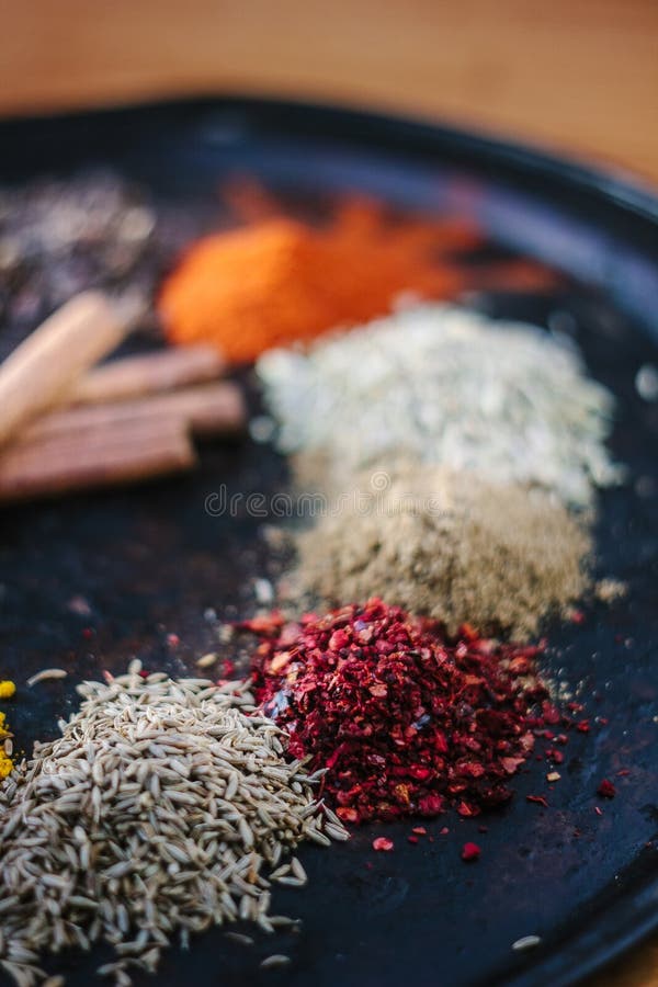 Red Sumac Spice on Black Metal Plate Surrounded by Other Spices. Stock ...