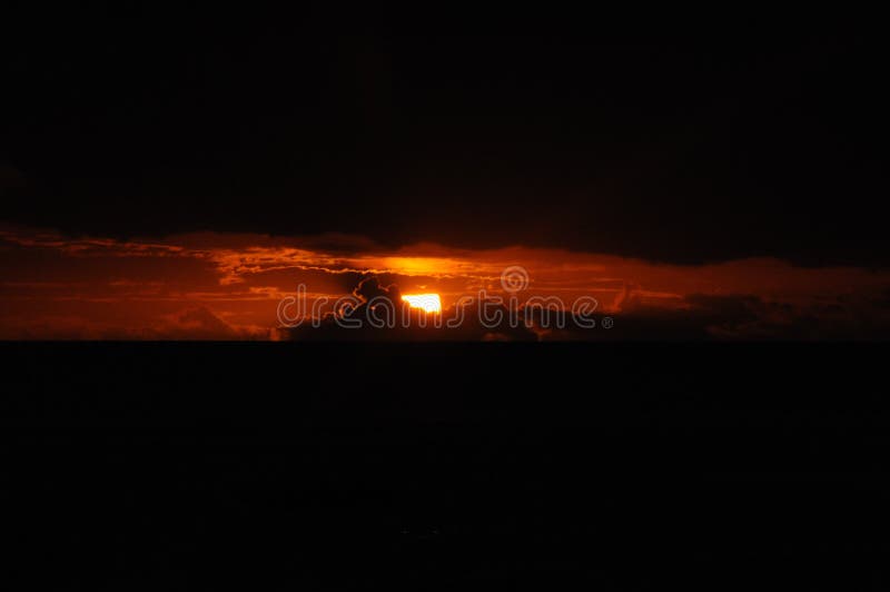 Red sun in the clouds stock image. Image of yellow, bright - 134277139