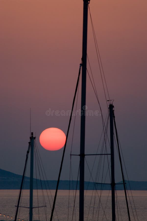 Red Sun and masts stock image. Image of tranquil, coast - 3308571