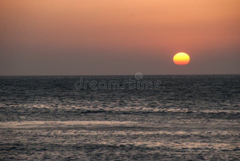 Red sun and sea at sunset stock image. Image of ocean - 65673523