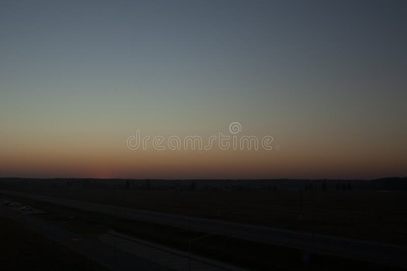 The Red Sun Set Below the Horizon. a Beautiful Sunset in a Clear Sky ...