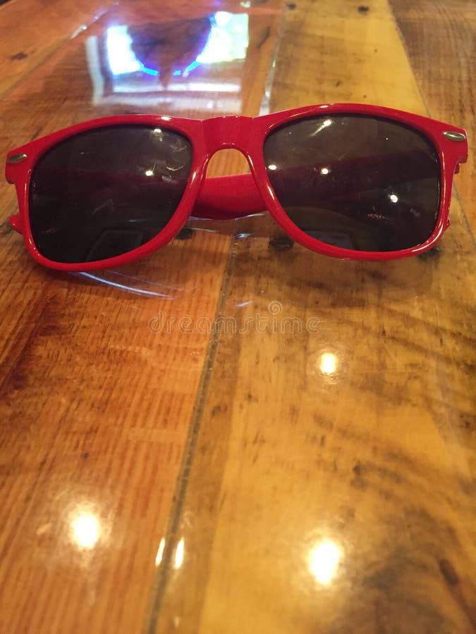 Red Sunglasses on Wooden Table Stock Photo - Image of sunglasses ...