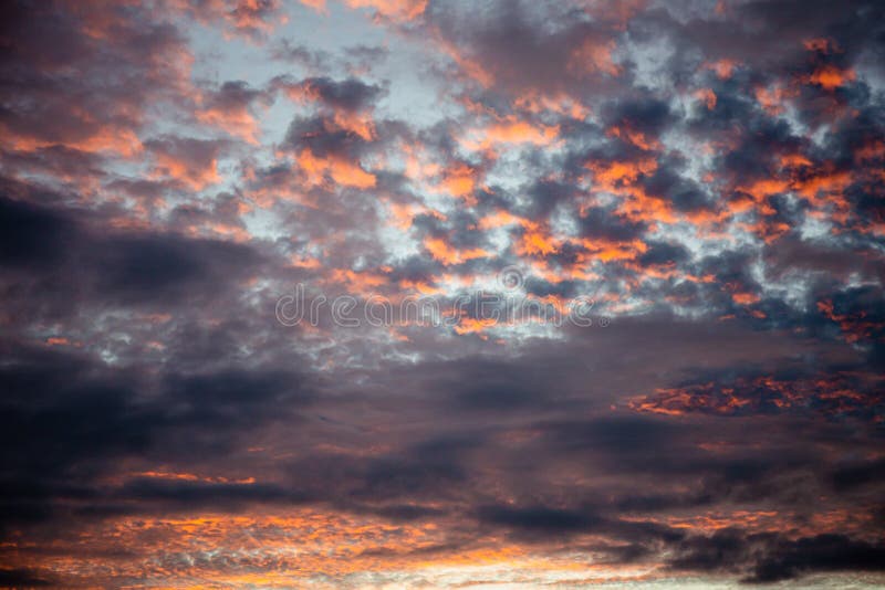 Red Sunlight in the Dark and Dramatic Storm Clouds. Stock Photo - Image ...