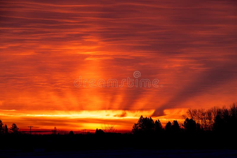 Red Sunrise with Sun Beams Coming through the Clouds Stock Image - Image of winter, cloud: 359870899