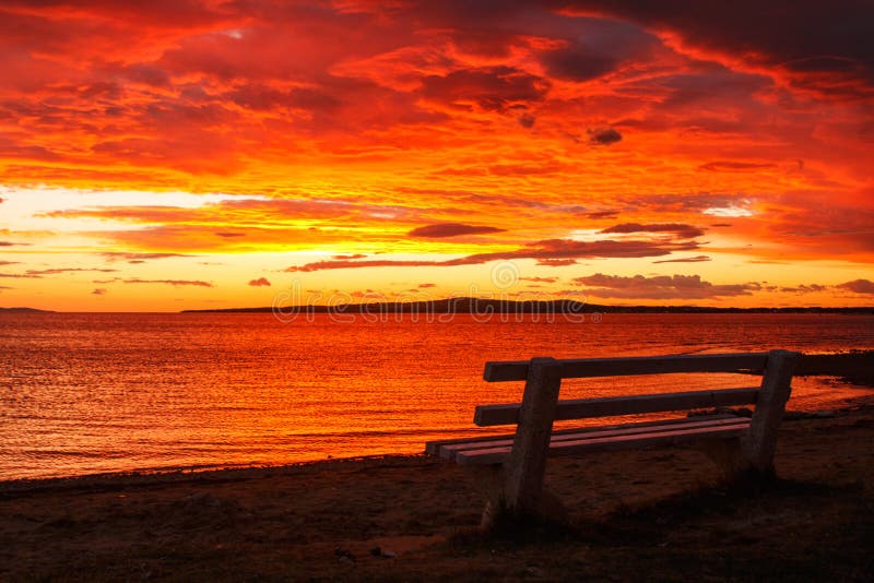 Red sunset stock image. Image of coast, silhouette, light - 77358395