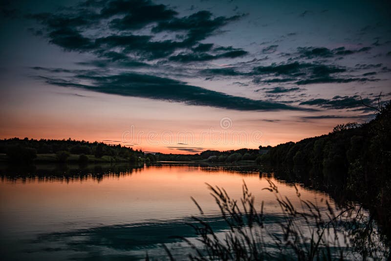 Red sunset on the lake stock photo. Image of evening - 251433582