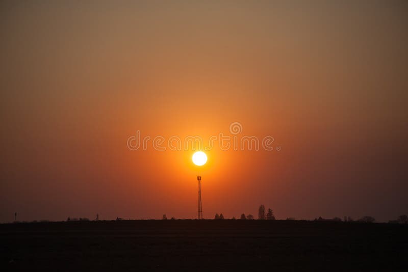 Red sunset over the field stock image. Image of scenery - 273262937