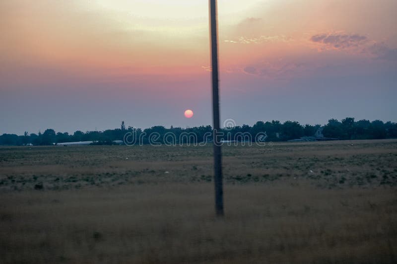 Red Sunset Over the Field Landscape Stock Photo - Image of field ...