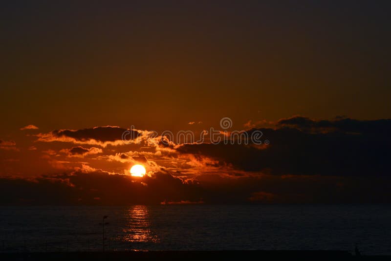 Red sunset over the ocean stock image. Image of silhouette - 117666205
