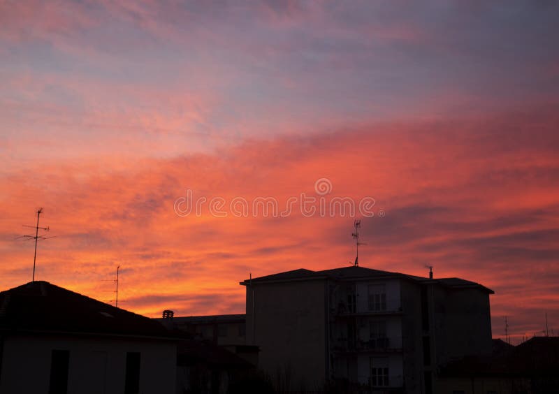Red sunset over the town stock photo. Image of evening - 135918928