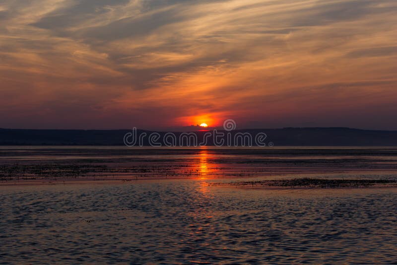 Red Sunset Over the Water. Dramatic Red Sunset Stock Image - Image of ...