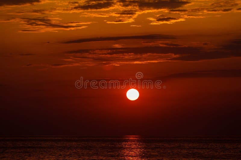 Red sunset over water stock photo. Image of ocean, color - 69578010