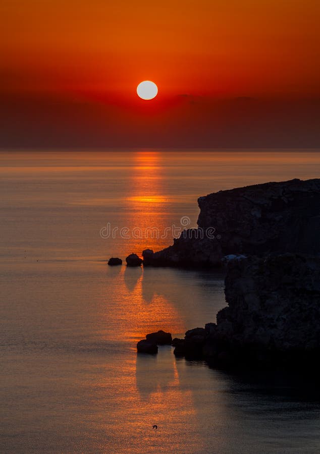 Red sunset over water stock photo. Image of mountain - 69578164