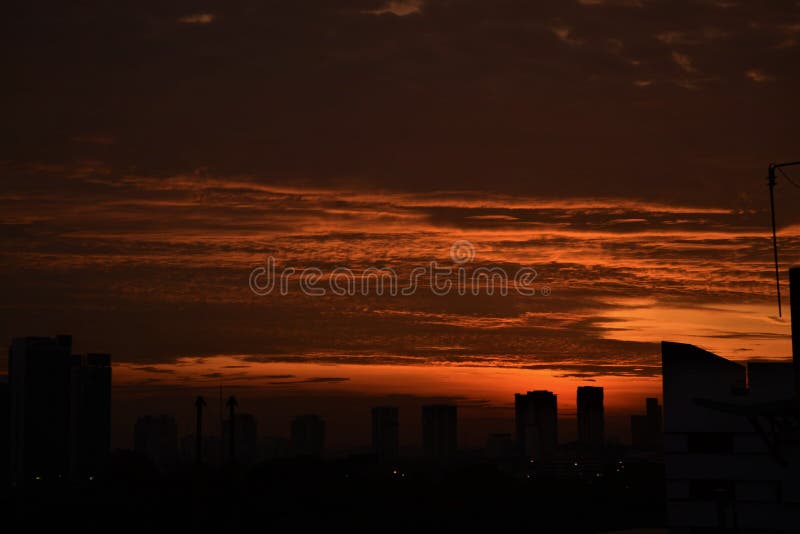 Red sunset sky in the city stock photo. Image of sunset - 223838878