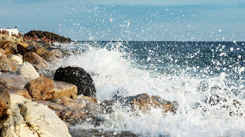 Red Sunset in the Surf on the Rocks and Splashes Stock Photo - Image of ...