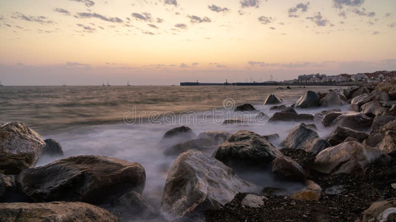 Red Sunset in the Surf on the Rocks and Splashes Stock Photo - Image of ...