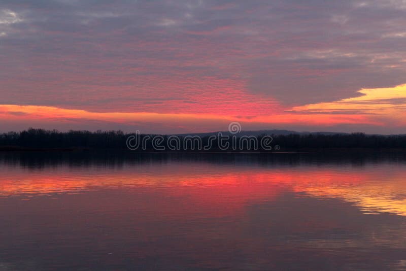 Red Sunset with a Symmetrical Reflection in the Water Stock Image ...