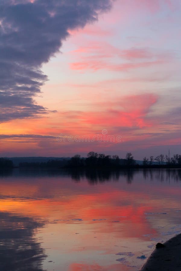 Red Sunset with a Symmetrical Reflection in the Water Stock Image ...