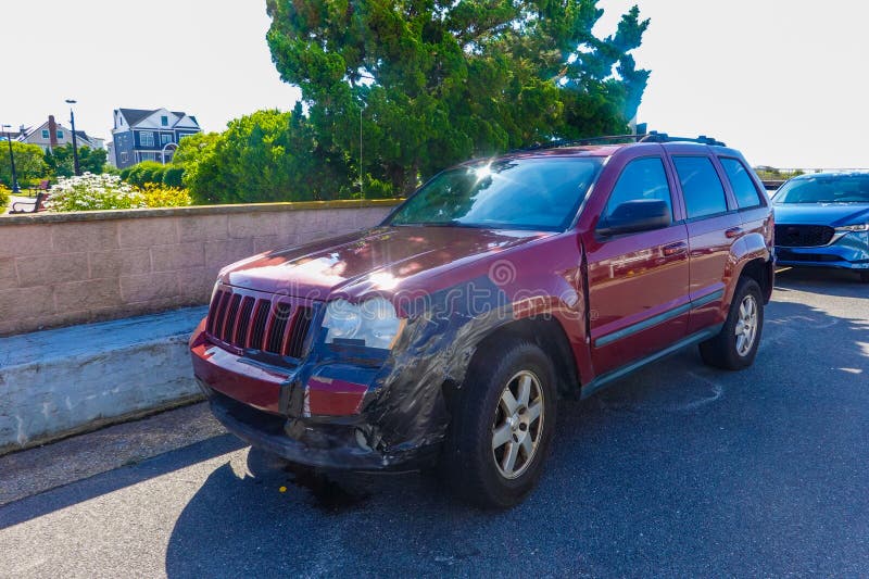 Red SUV with Front End Damage that Was Repaired with Black Duct Tape ...