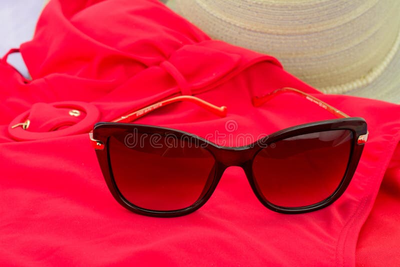 Red Swimming Suit with Sunglasses and Hat for Summer Stock Photo ...
