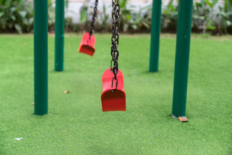 Red Swing on Children Playground in City Stock Photo - Image of child ...