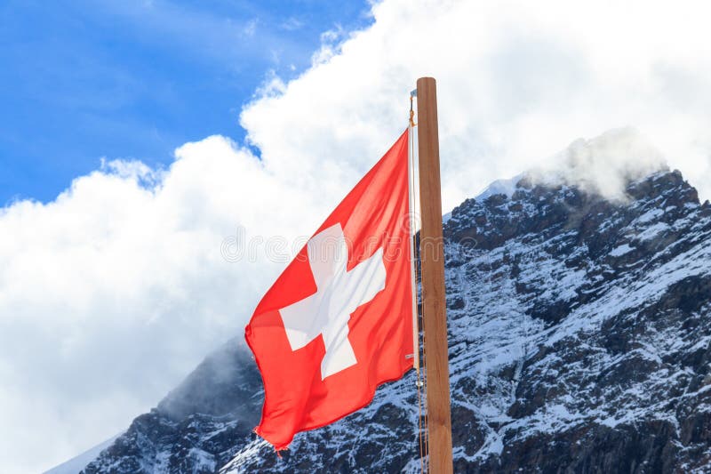 Red Swiss Flag Over Swiss Alps Background Stock Image - Image of ...