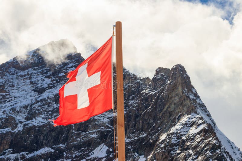 Red Swiss Flag Over the Swiss Alps Stock Image - Image of cliff, europe ...