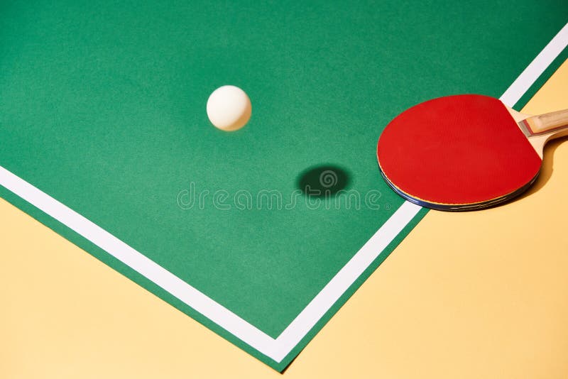 Red Table Tennis Racket and Ball on Paying Table and Yellow Stock Image ...