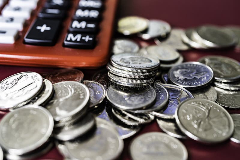 Red Table Top Calculator with Silver Coins Stock Photo - Image of ...