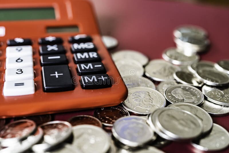 Red Table Top Calculator with Silver Coins Stock Photo - Image of ...