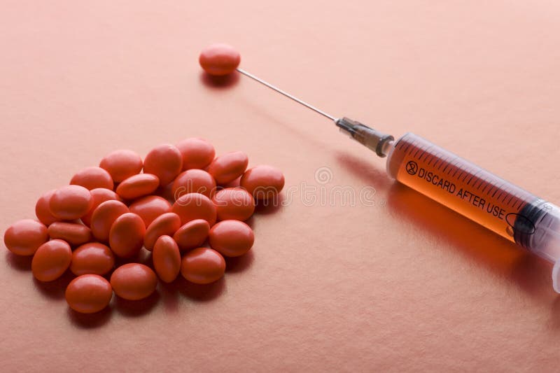 Red Tablet and Syringe on Red Closeup Stock Photo - Image of medical ...