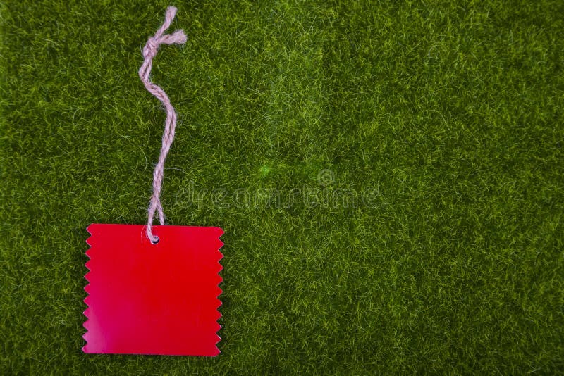 Red tag on a green grass stock photo. Image of meadow - 99933956
