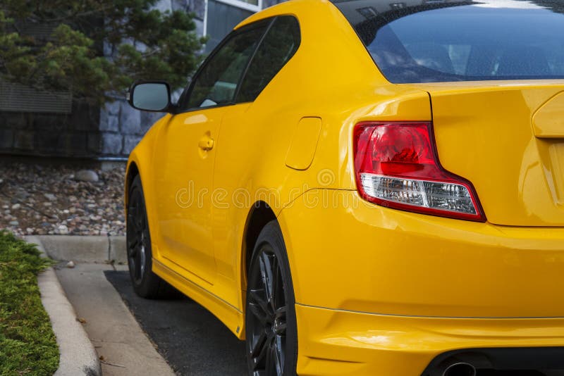 Red Taillight on Bright Yellow Car Stock Image - Image of style, metal ...
