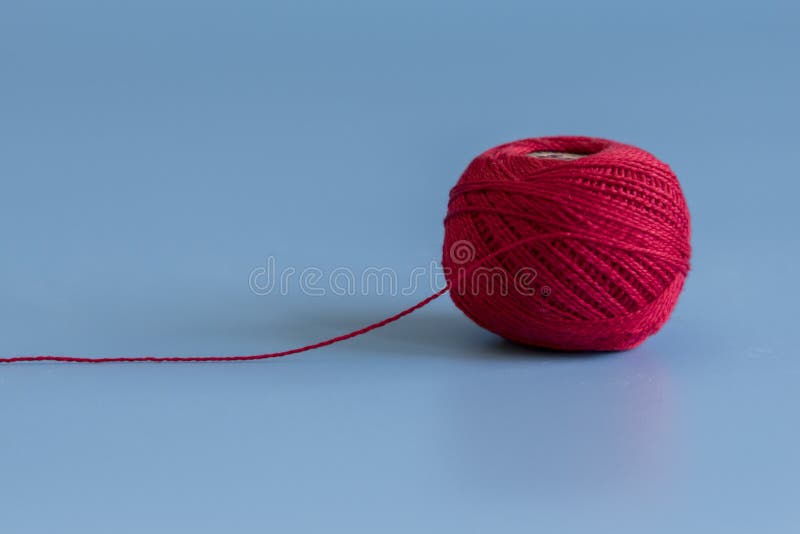 Red Tangle of Thread on a Blue Background Stock Image - Image of blue ...