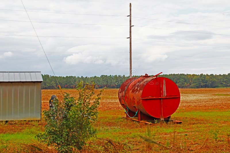 A red tank in a field stock image. Image of water, station - 198803463