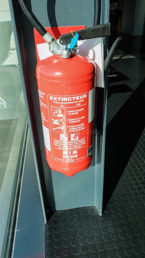 Red Tank of Fire Extinguisher. Fire Extinguishing System Editorial ...