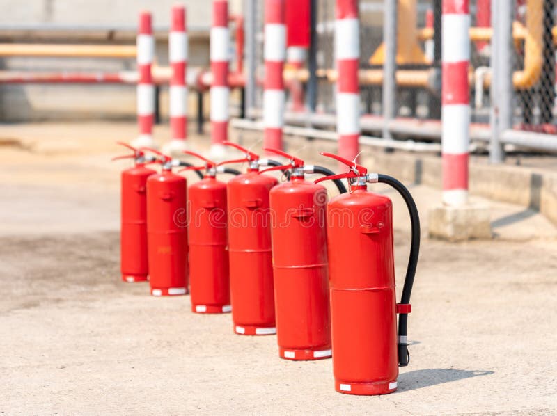 The Red Tank of Fire Extinguishers are Lined Up on the Floor Stock ...