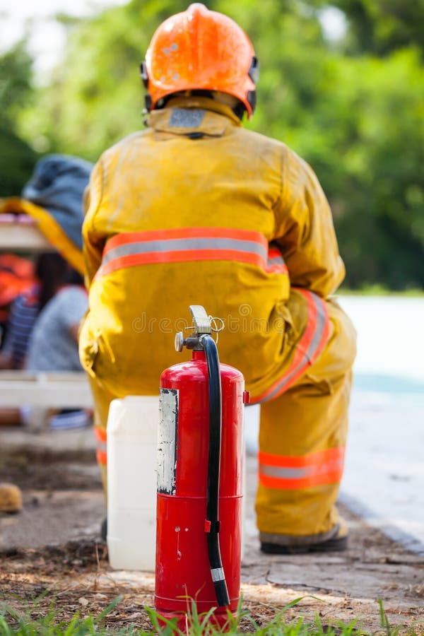 Red Tank of Fire,Firefighter with Fire and Suit for Protect Stock Photo ...