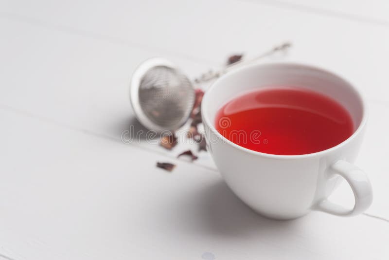 Red Tea in White Cup.the Brewing Process,Dry Tea Leaves, White ...